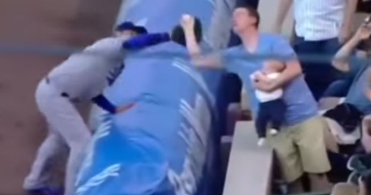 Baseball fan catches ball while feeding baby | The New Daily