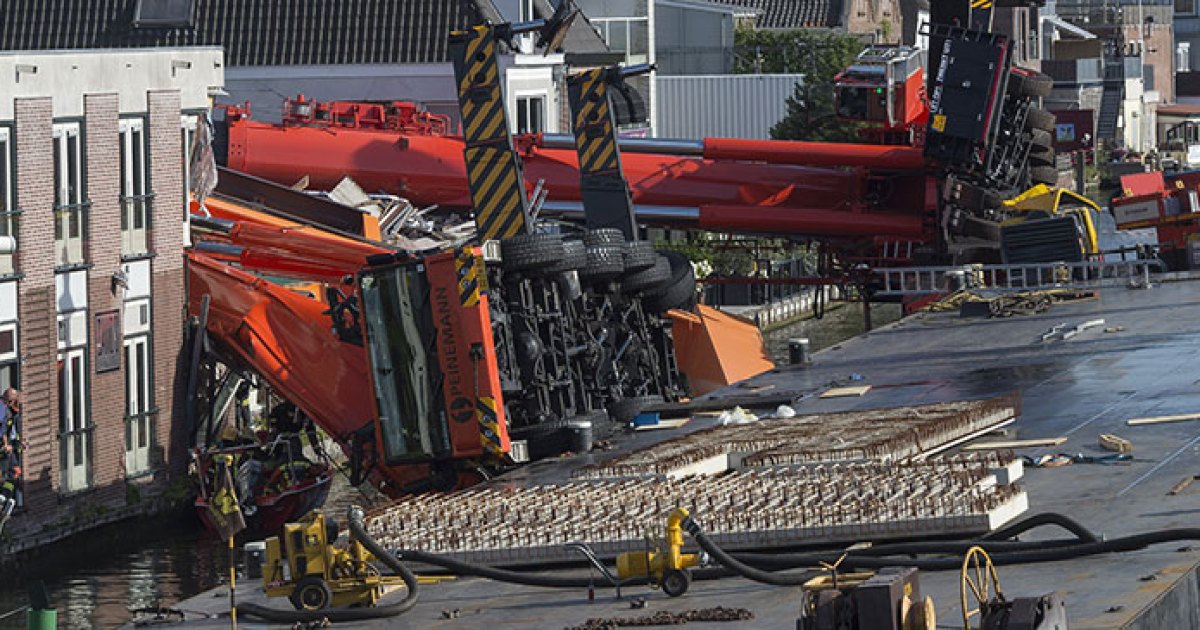 Dramatic scenes as work cranes smash into homes | The New Daily