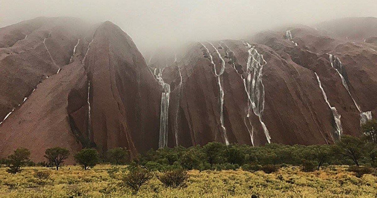 Uluru puts on spectacular show after one-in-50-year rainfall