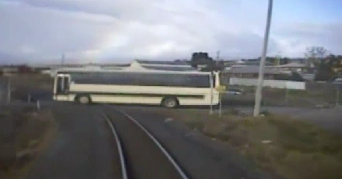 Train misses school bus at crossing by seconds in 'near-tragedy'
