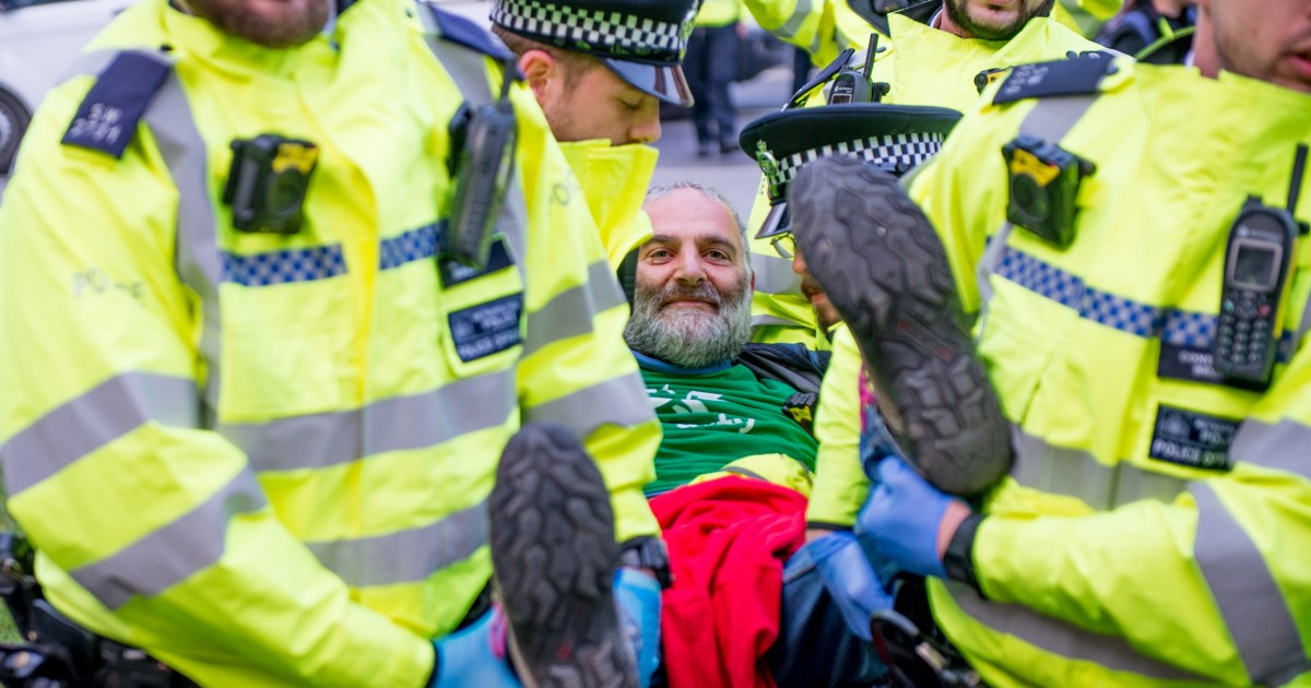 Climate protesters disrupt trains, glue themselves to fence