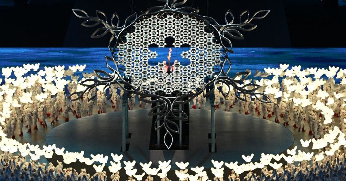 Giant snowflake lights up a restrained Winter Olympics opening ceremony