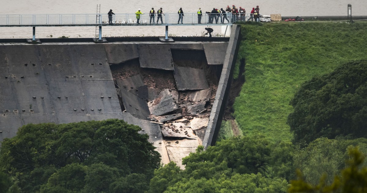 English town evacuated as dam wall partially collapses