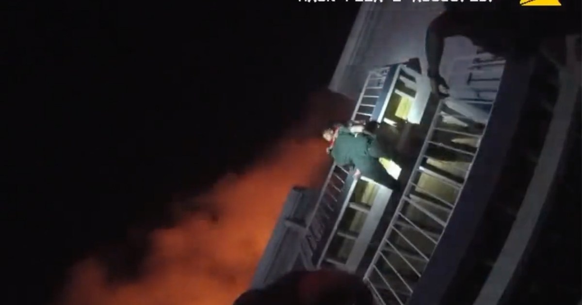 Watch: Policeman's heroic climb up burning building to save baby