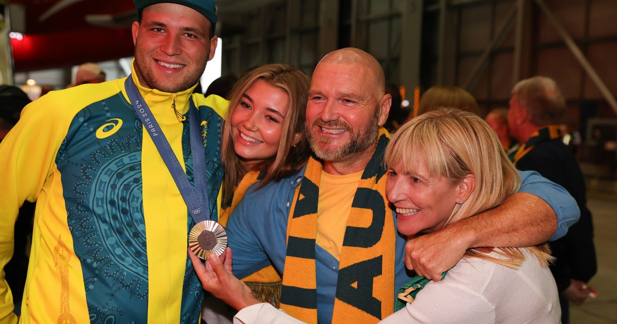 Tears, cheers and hugs as triumphant Olympians arrive home