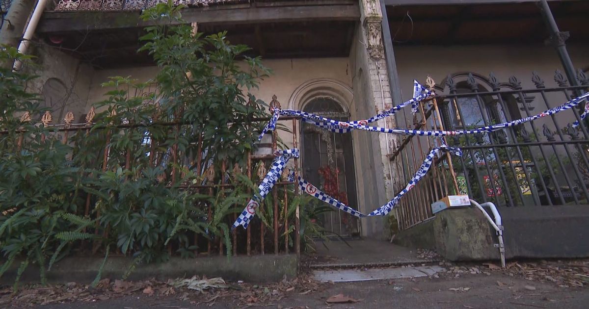 Woman lived with decomposing bodies for weeks, police say