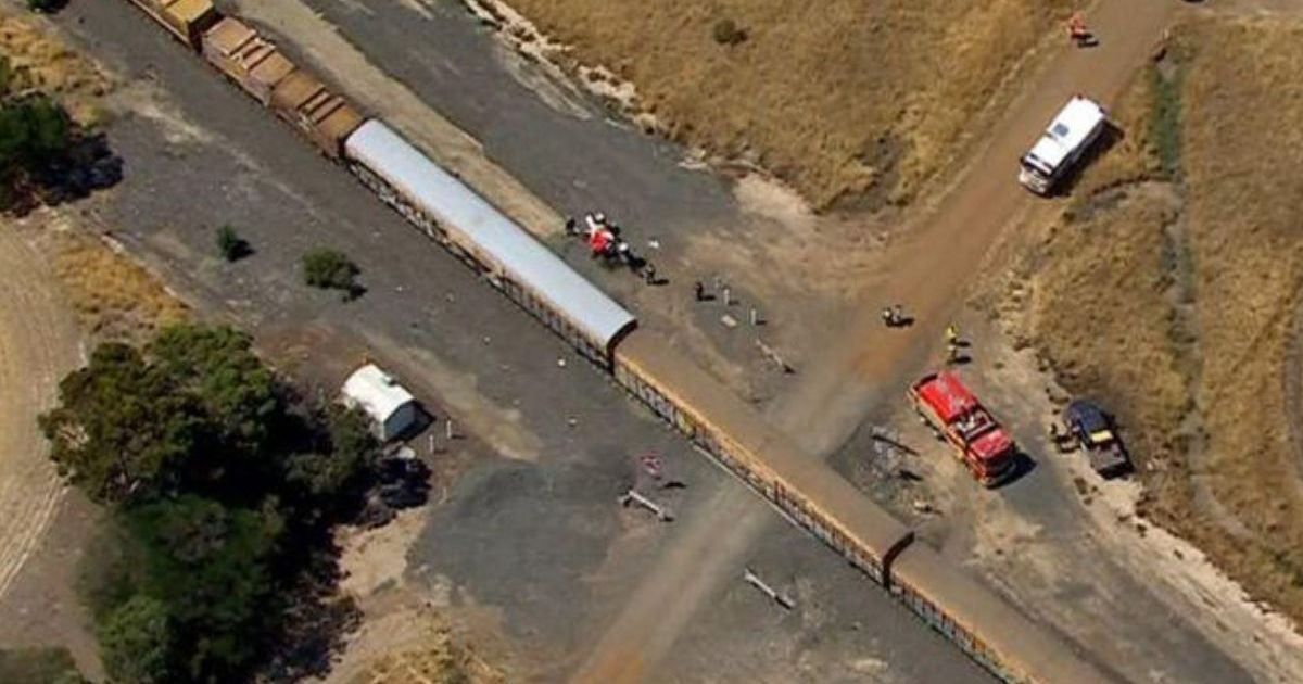 Two dead after car and freight train collide